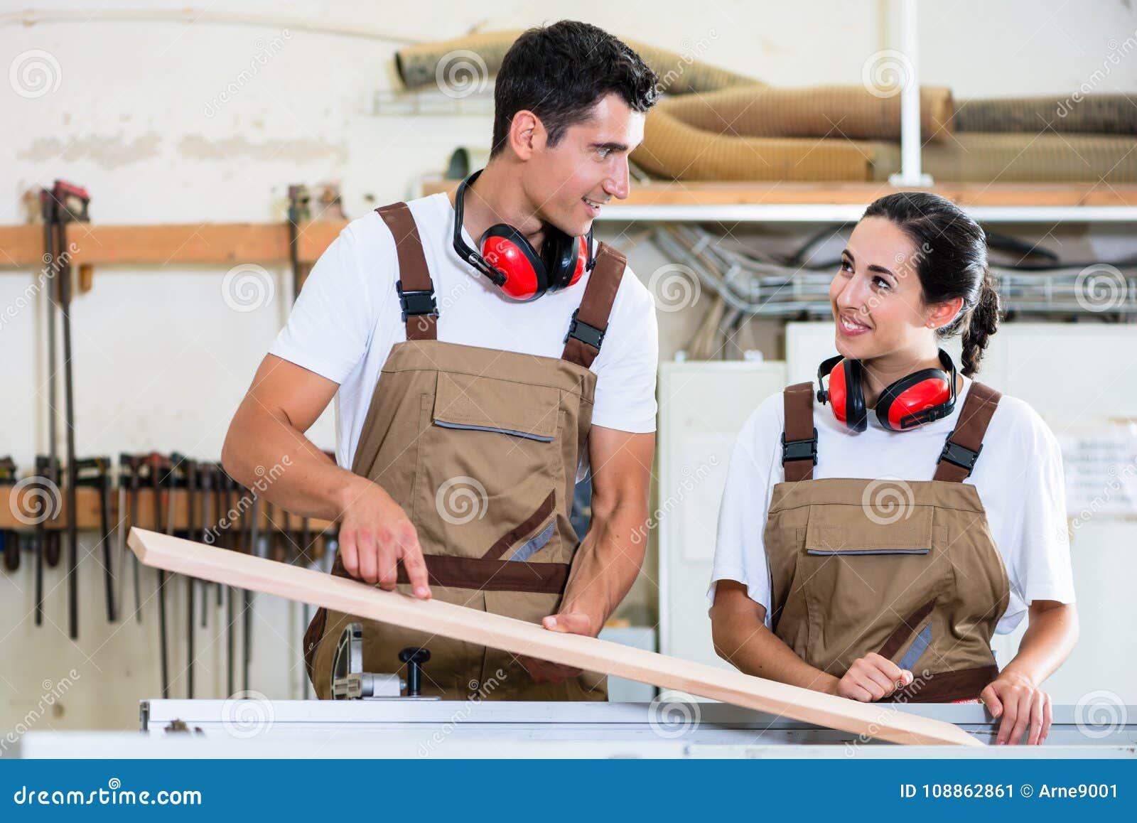 Carpenter and Apprentice Working Together in Workshop Stock Image ...