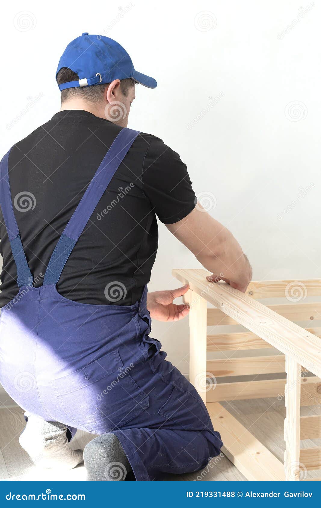 A Carpenter Assembles a Wooden Structure from Slats. Carpentry Work ...