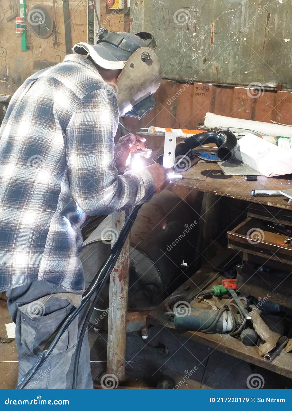 Carpenter from Behind and with Protective Material Working in Carpentry ...