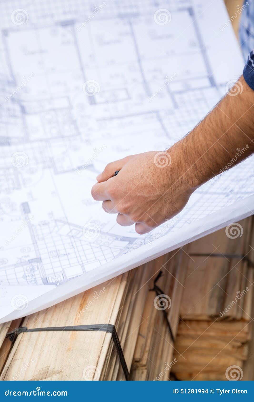 Carpenter with Blueprint at Site Stock Photo - Image of house, lumber ...