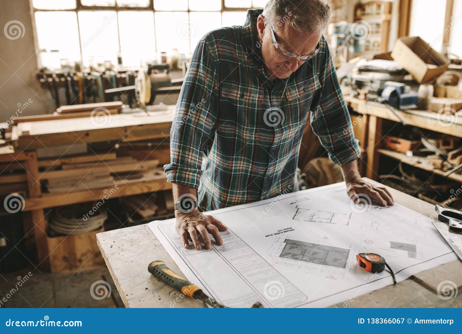 Carpenter Checking the Building Plans before Starting Stock Image ...