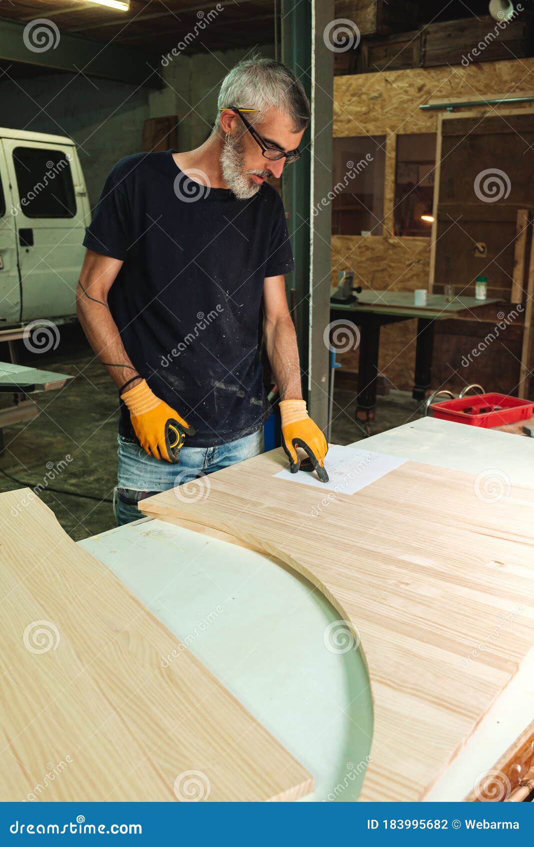 Carpenter Checking a Piece of Wood on a Plan Stock Photo - Image of ...