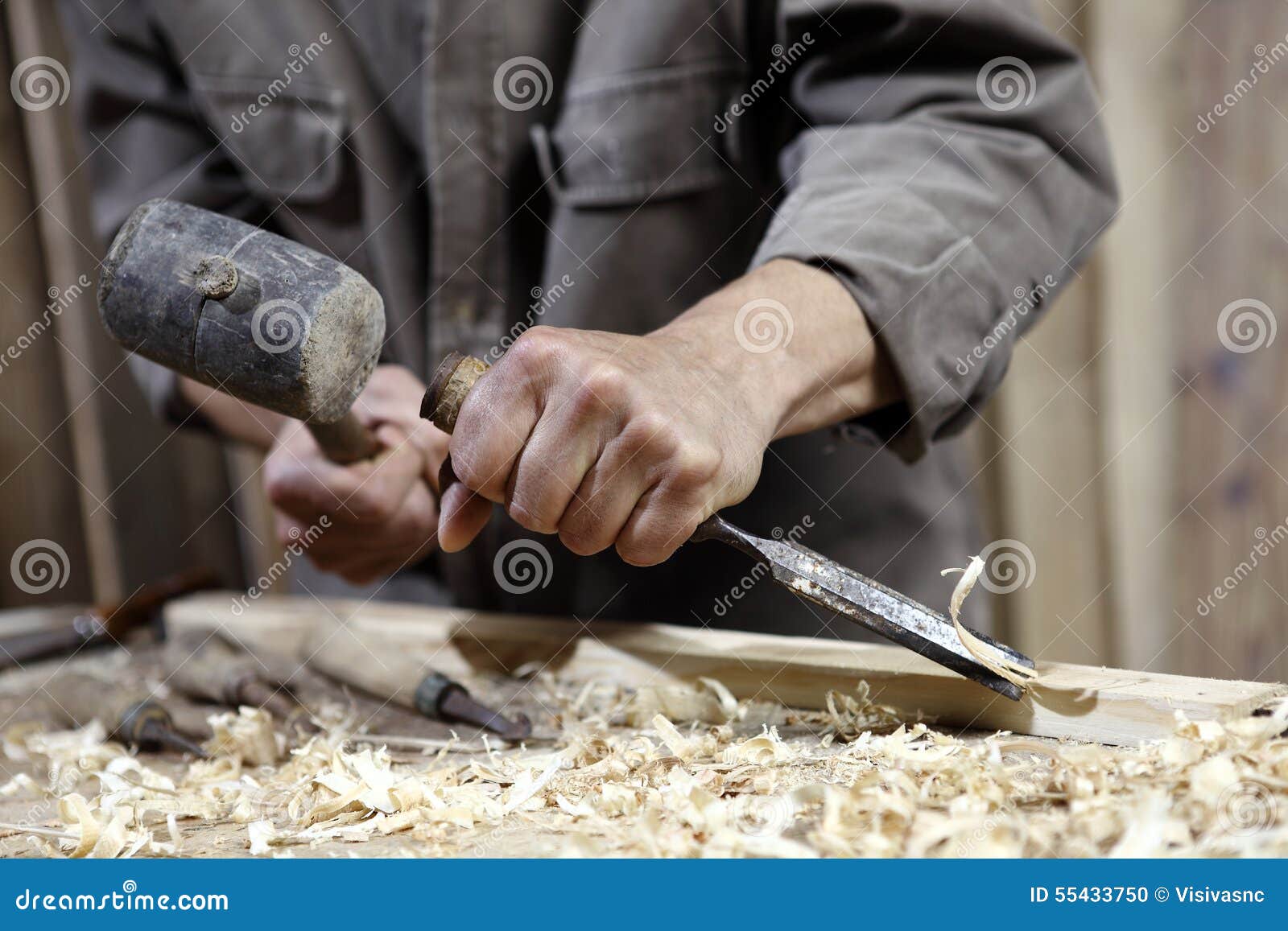 Carpenter with Chisel in the Hands on Workbench in Carpentry Stock ...