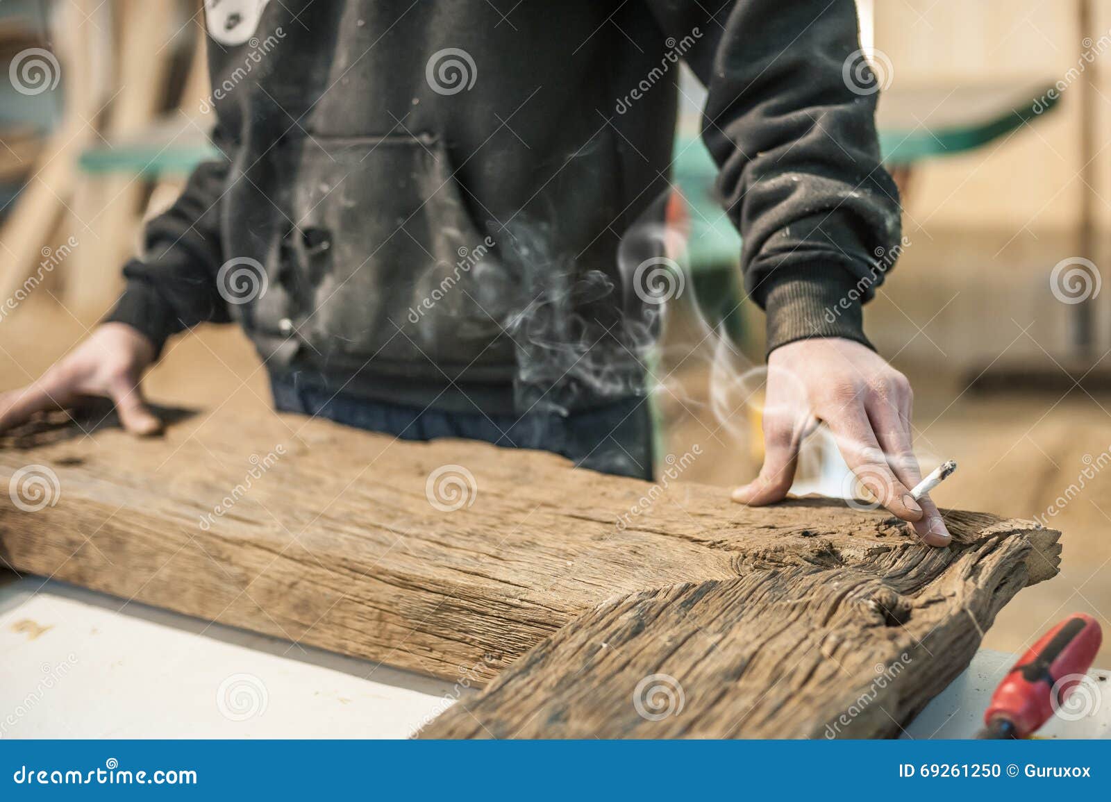 Carpenter with cigarette stock photo. Image of sander - 69261250