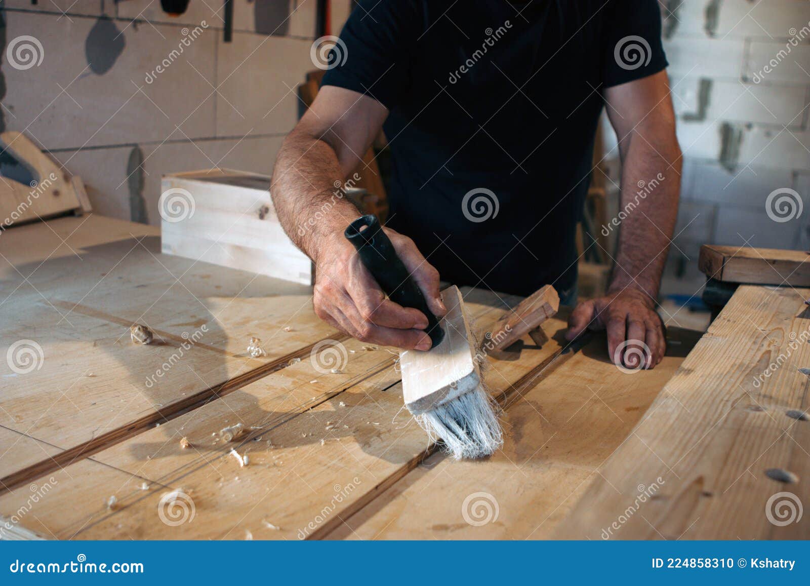 Carpenter Cleaning His Workbench after Work Stock Photo - Image of ...