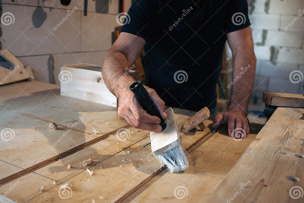 Carpenter Cleaning His Workbench after Work Stock Photo - Image of ...