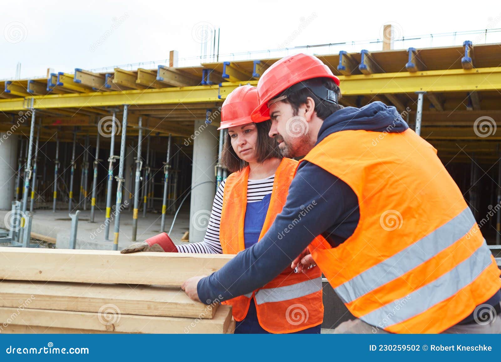 Carpenter and Colleague Load Lumber Stock Photo - Image of cutting ...