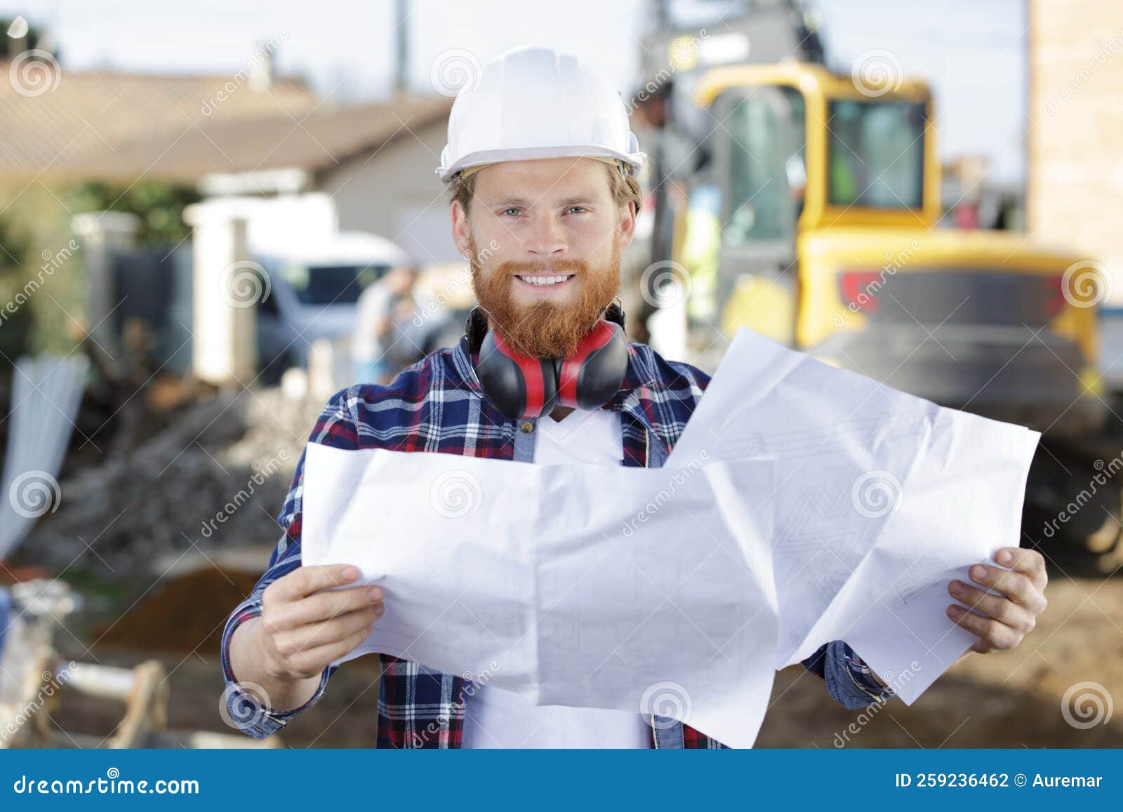 Carpenter Consulting Blueprints in Front Construction Site Stock Photo ...