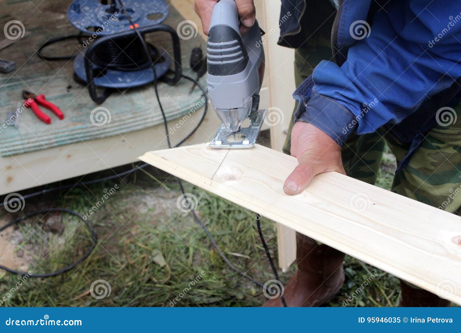 Carpenter Cutting with a Jigsaw Plate. Stock Image - Image of cutting ...