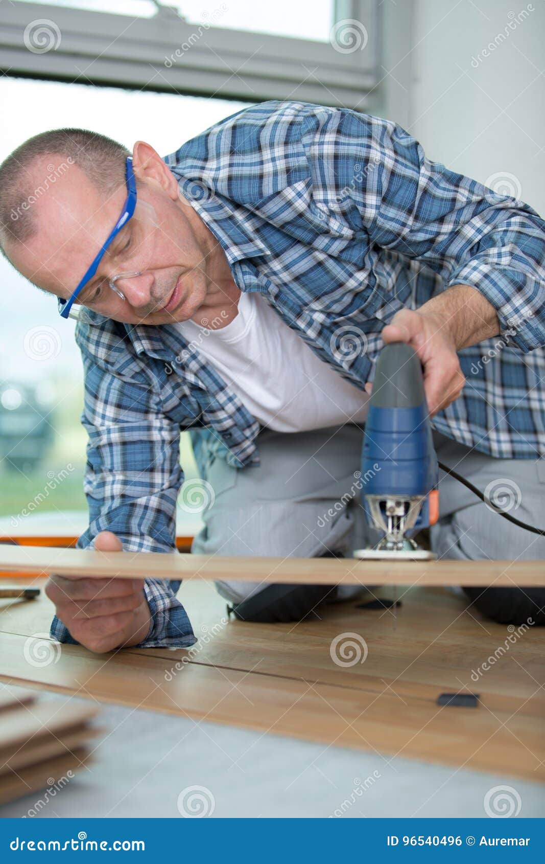 Carpenter cutting wood stock photo. Image of blade, cutting - 96540496
