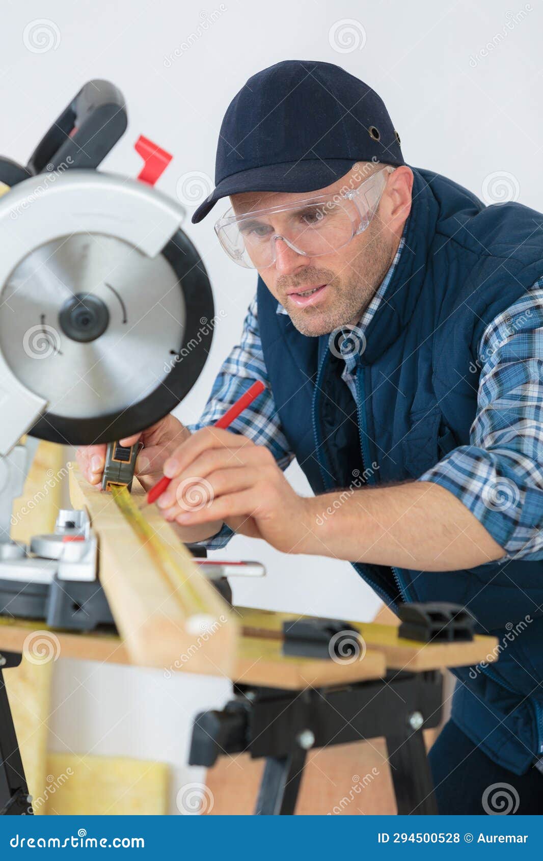 Carpenter Cutting Wood Using Drop Saw Stock Photo - Image of dust ...