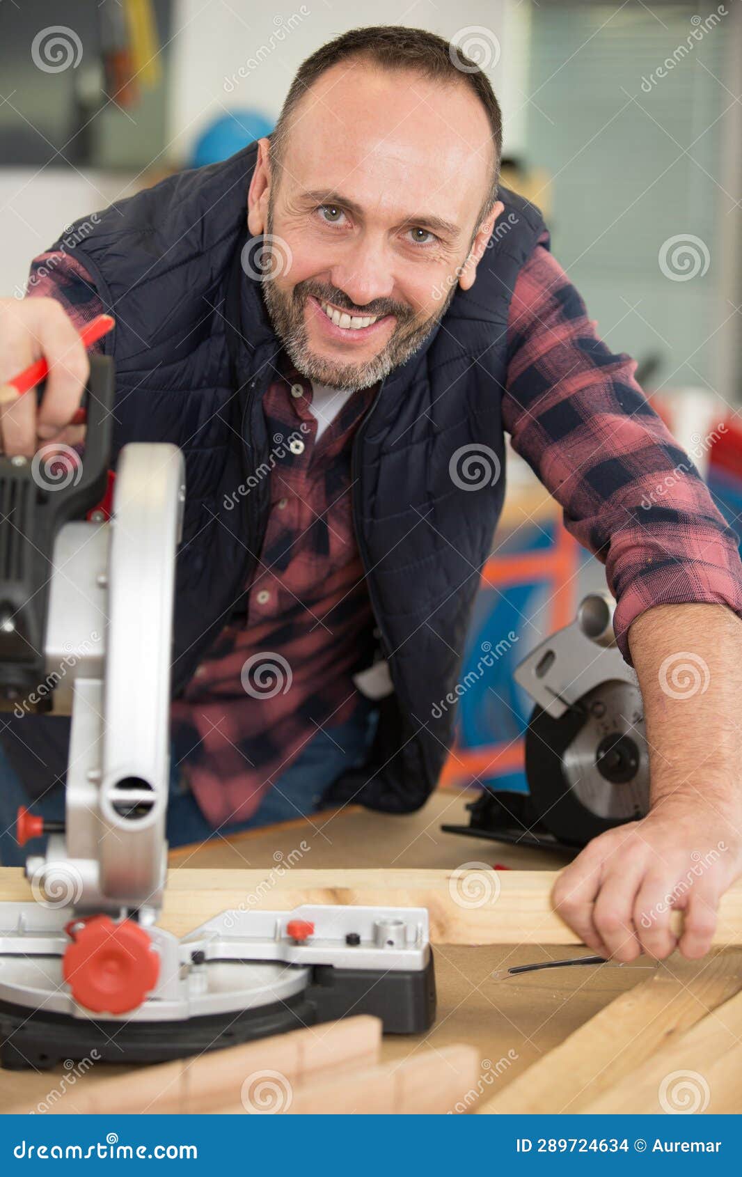 Carpenter Cutting Wood in Workshop Stock Photo - Image of construction ...