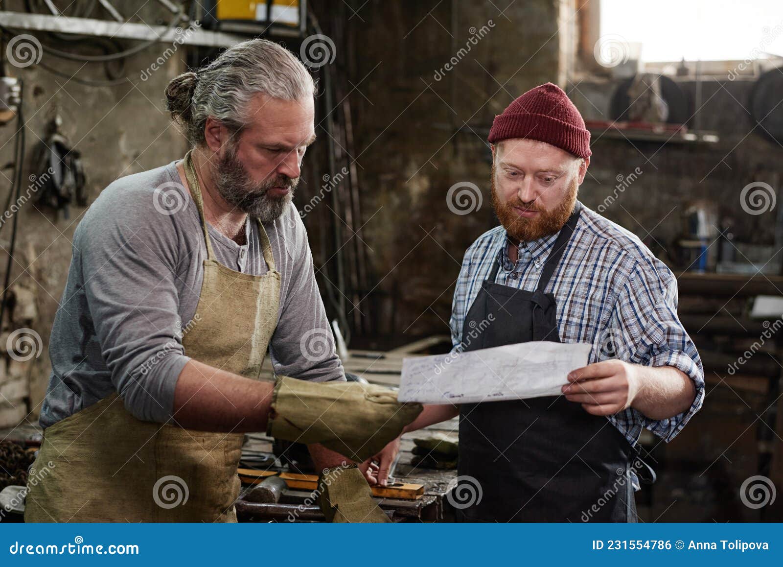 Carpenters Examining Blueprint in Team Stock Photo - Image of adult ...