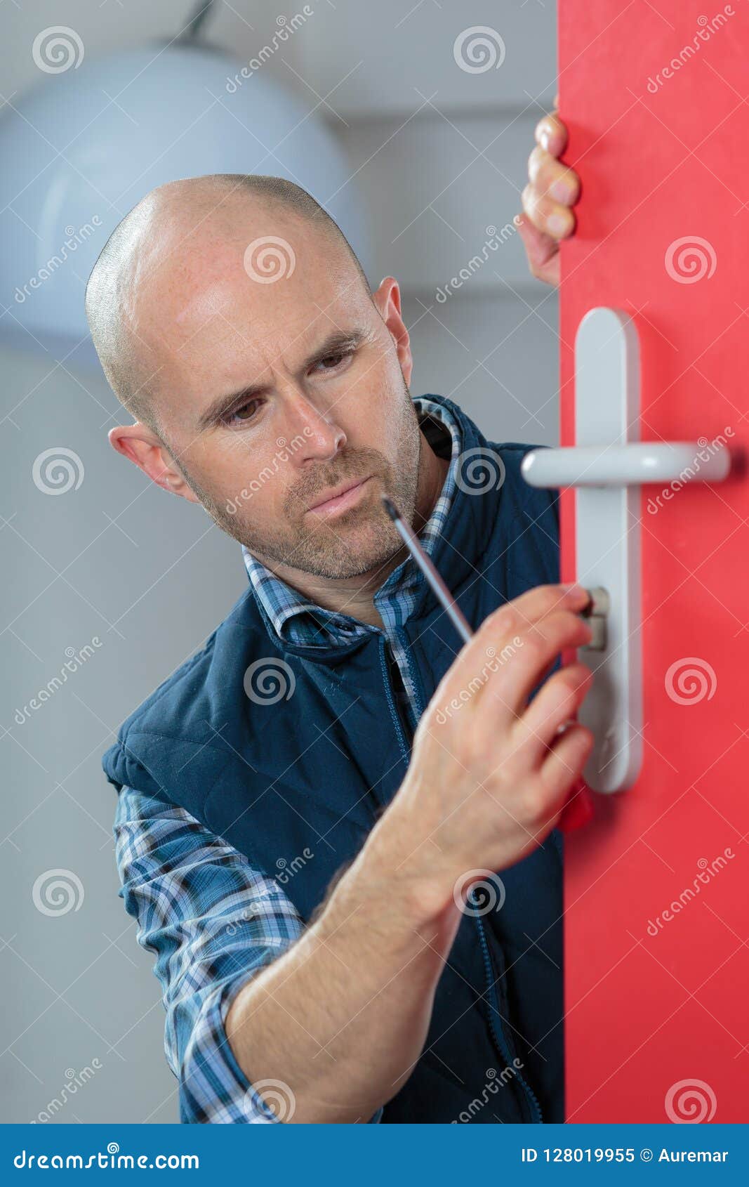 Carpenter with Doorlock during Lock Process Installation Stock Image ...