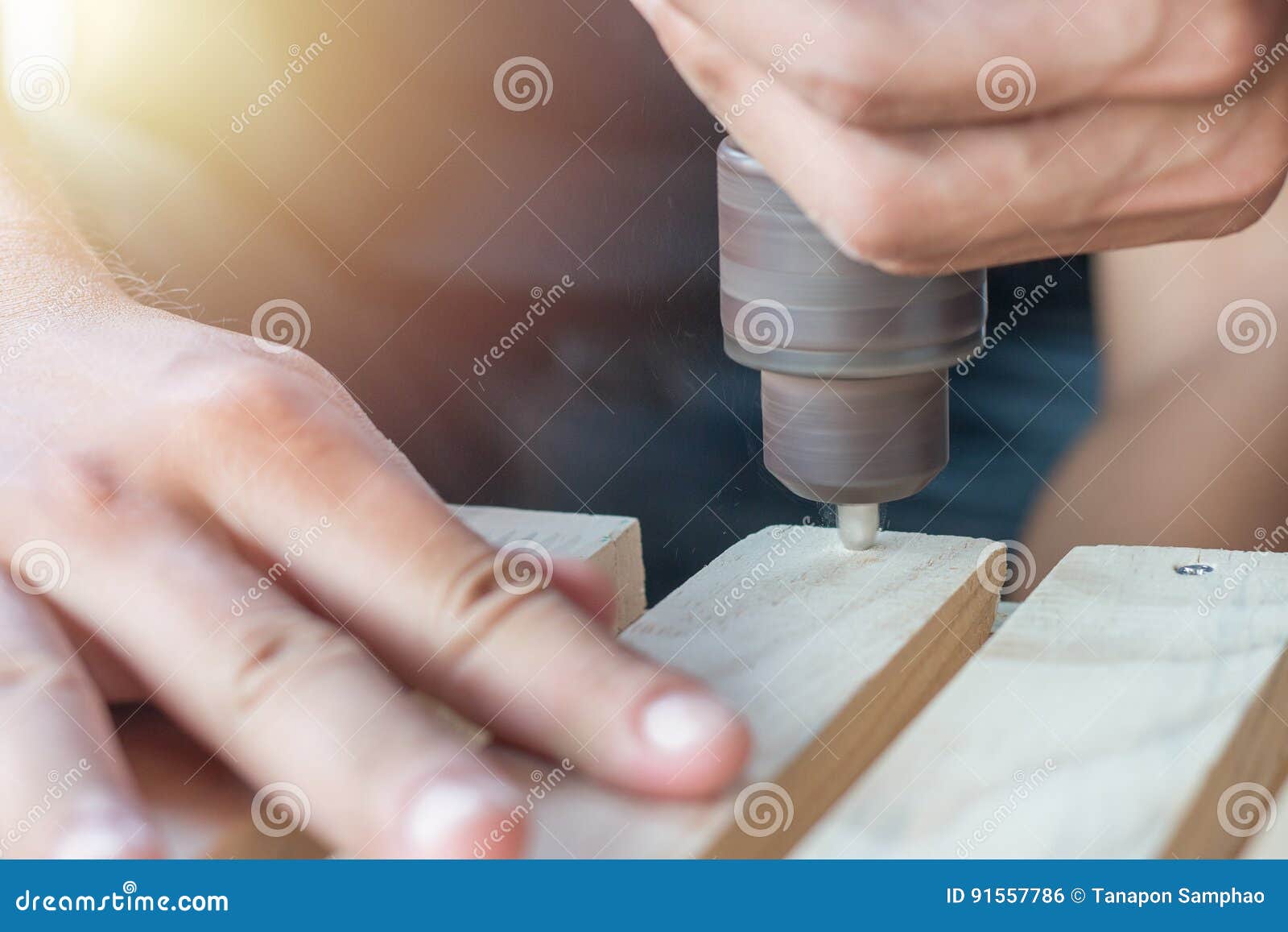 Carpenter Drill a Wooden Board with an Electric Drill Stock Photo ...