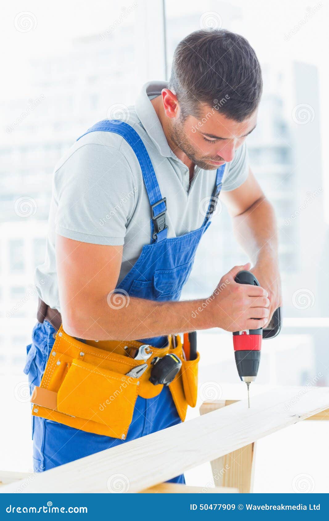 Carpenter Drilling Wood Using Portable Drilling Machine Royalty-Free ...