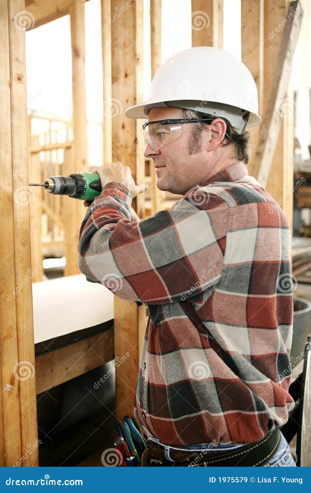 Carpenter Drilling Safely stock image. Image of labor - 1975579