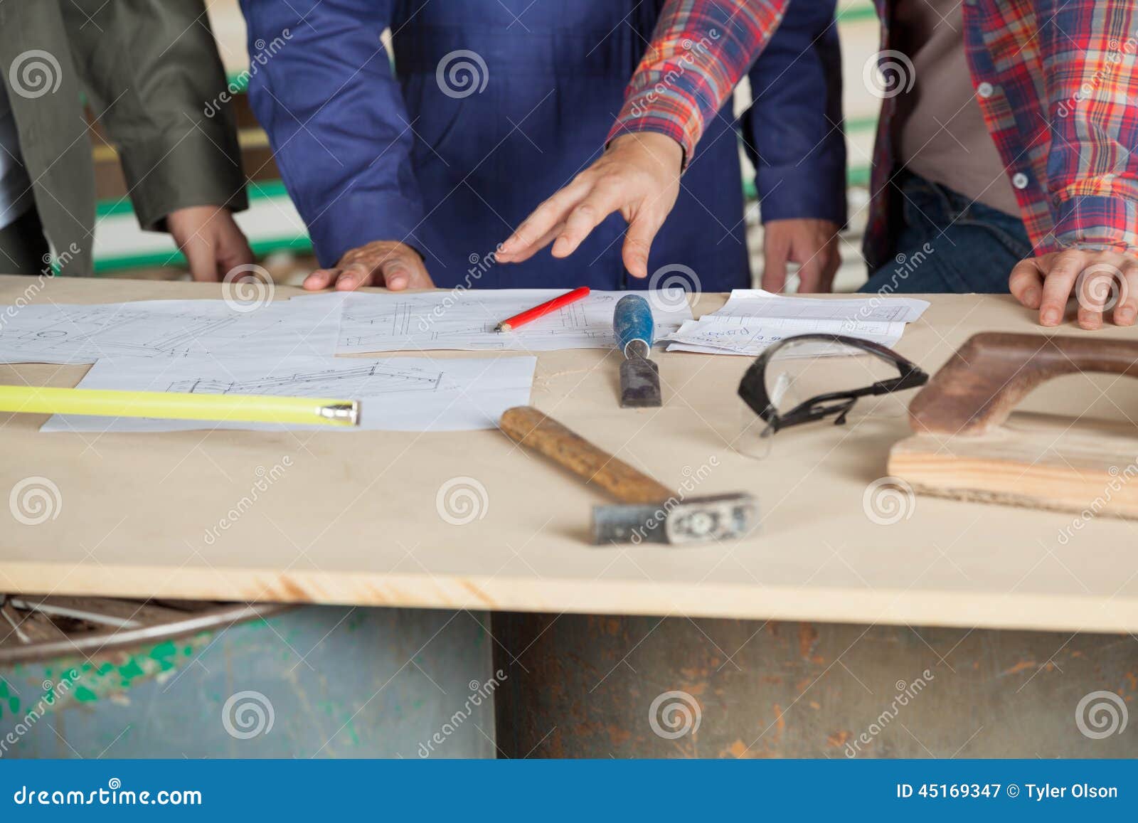 Carpenter Explaining Blueprint To Colleagues at Stock Image - Image of ...