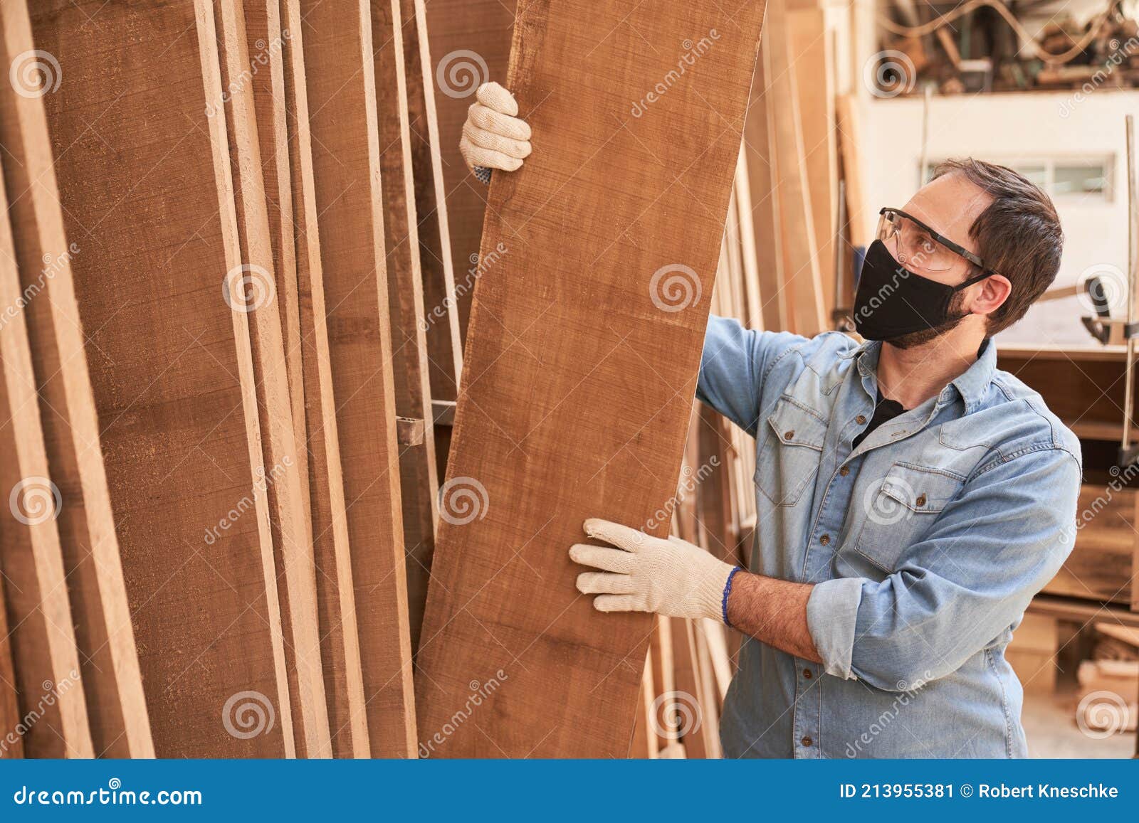 Carpenter with Face Mask Selects a Board Stock Image - Image of class ...