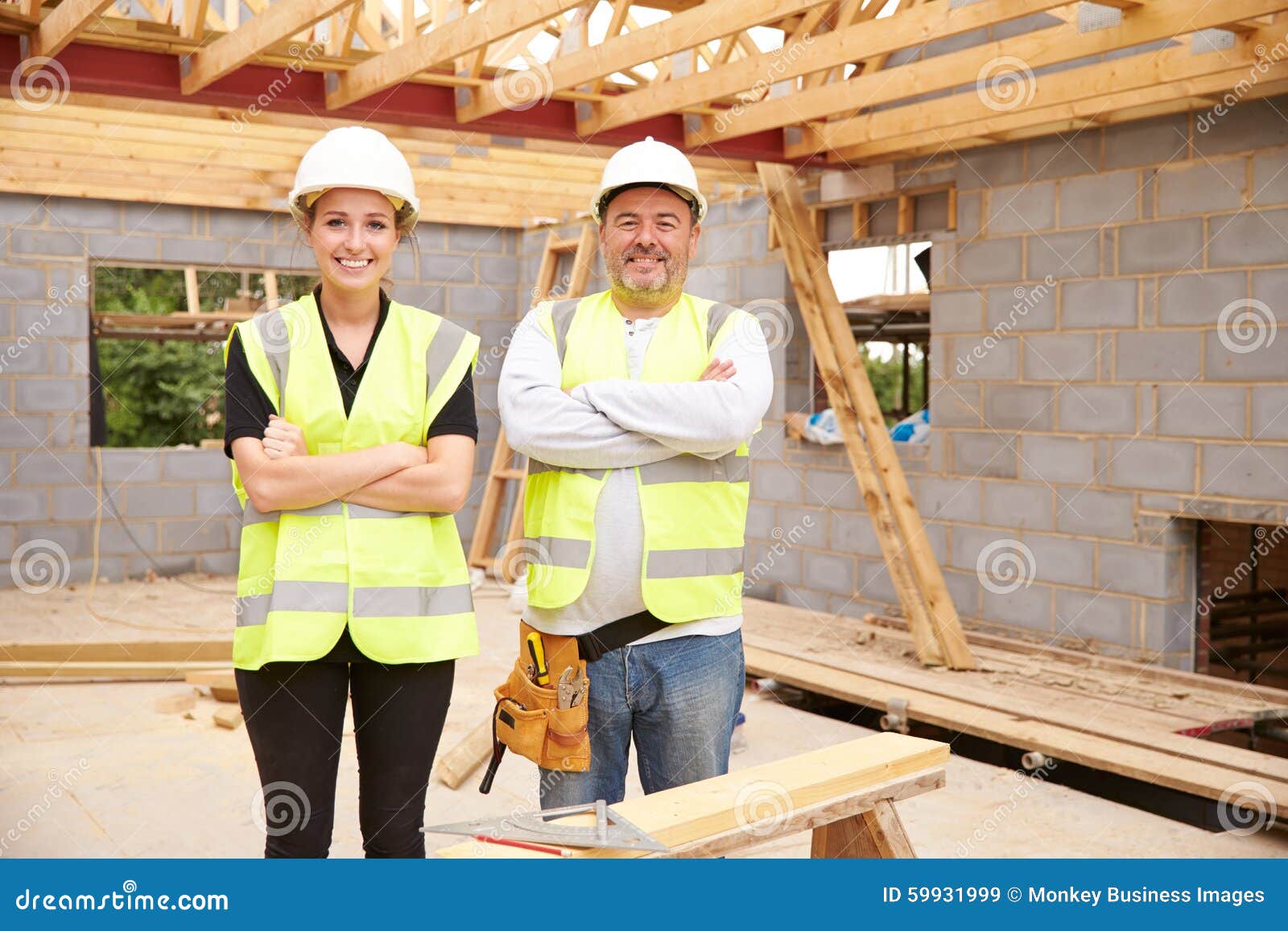 Carpenter with Female Apprentice Working on Building Site Stock Image ...