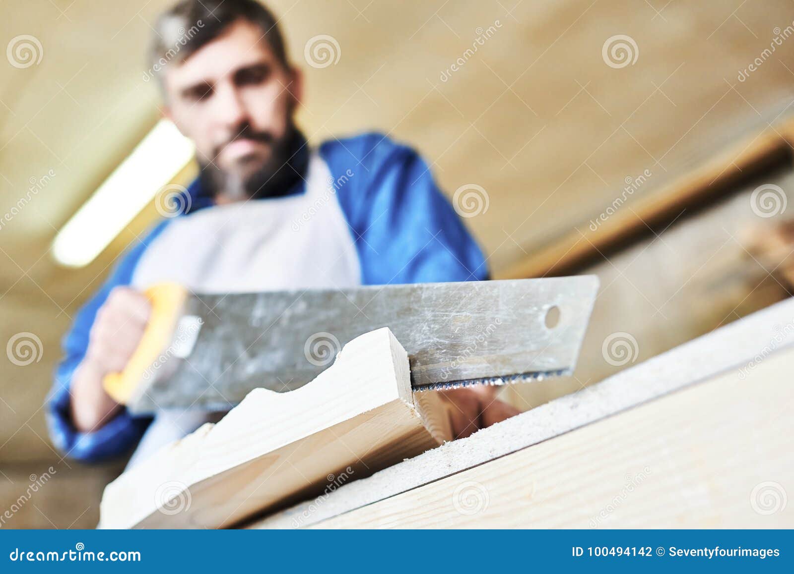 Carpenter Hand Cutting Wood Stock Photo - Image of handsaw, workshop ...
