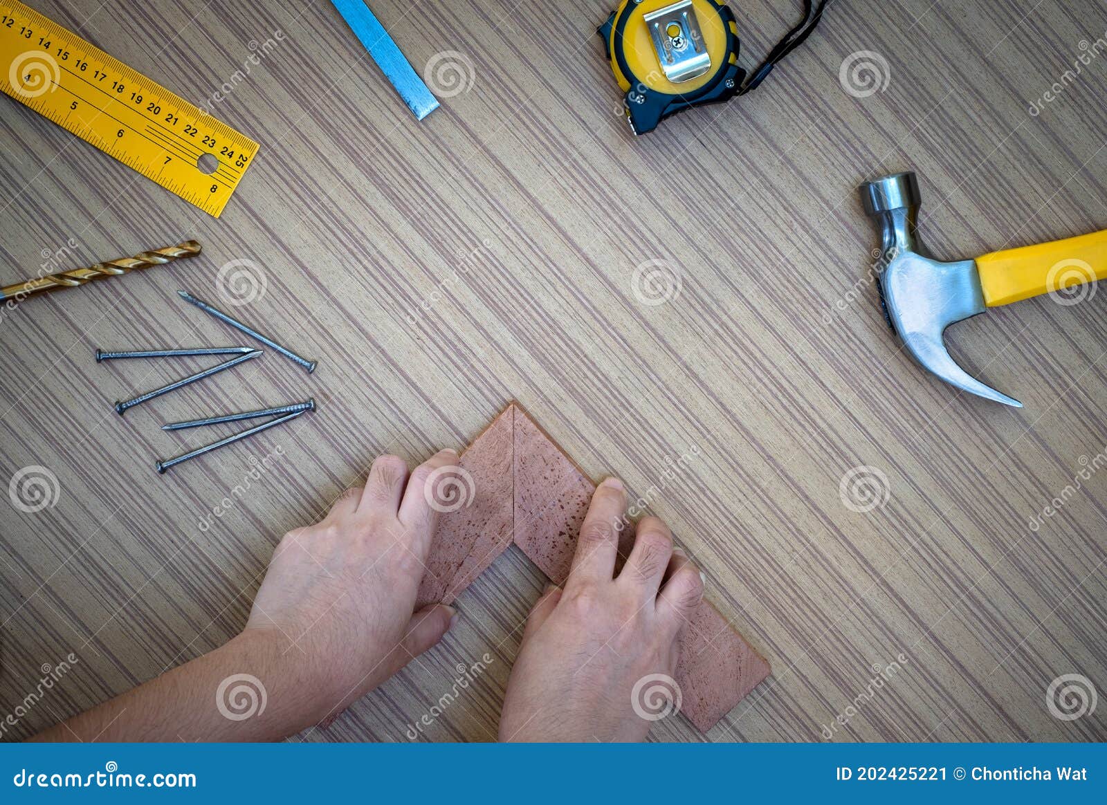 Carpenter Hands Measuring Wood Plank with a Set Collection of Working ...