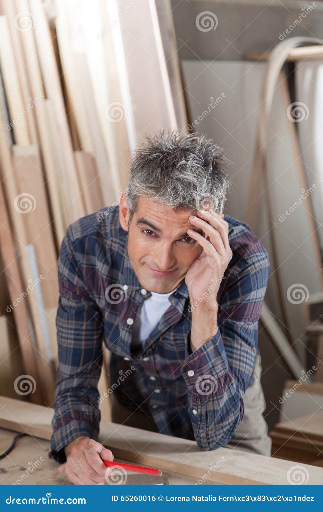 Carpenter holding his head stock photo. Image of camera - 65260016