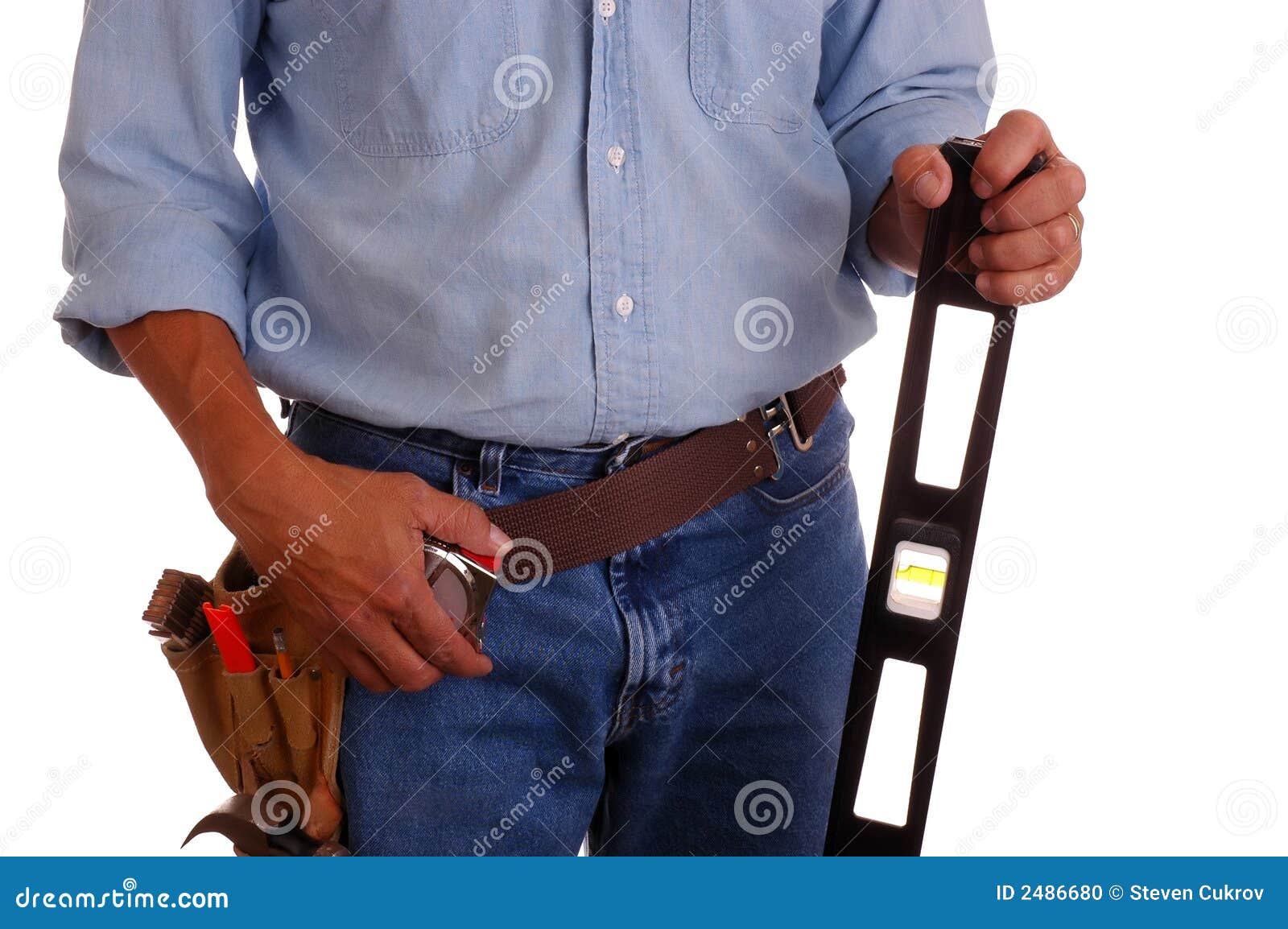 Carpenter holding level stock photo. Image of tools, worker - 2486680