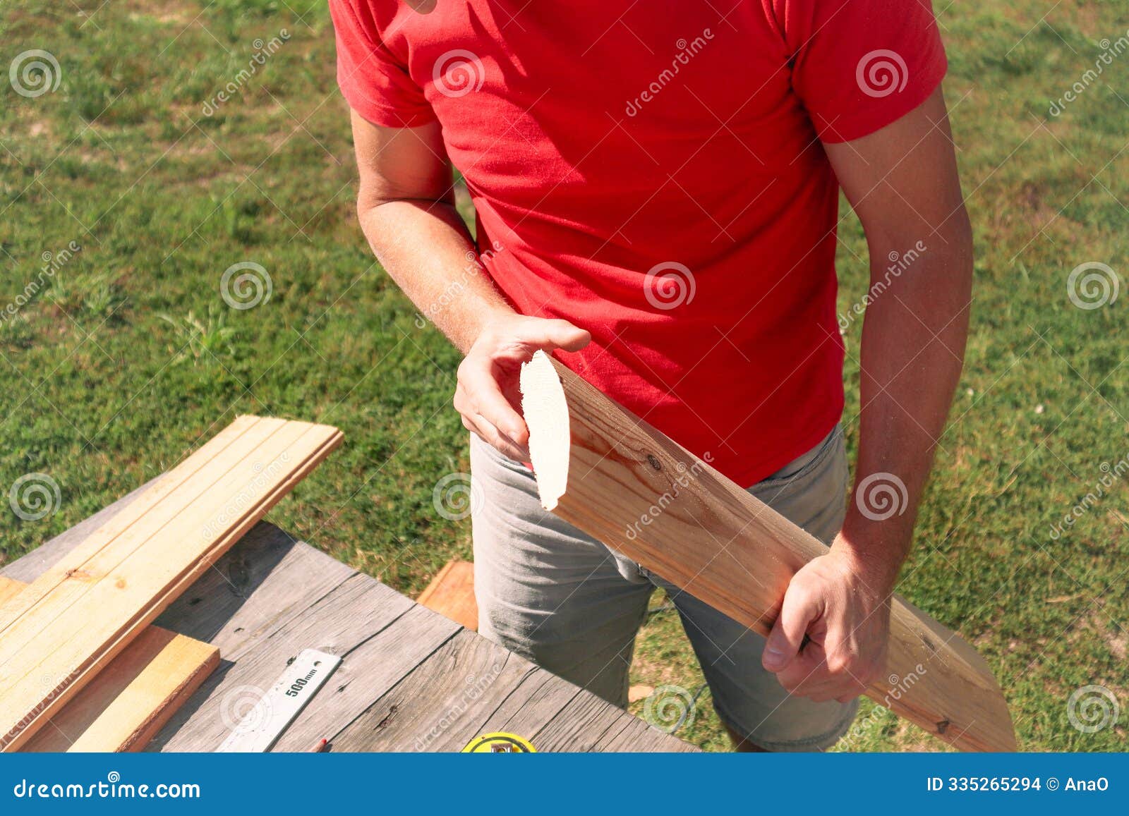 Carpenter Installing Decking Boards. Carpenter Building Wooden Deck ...