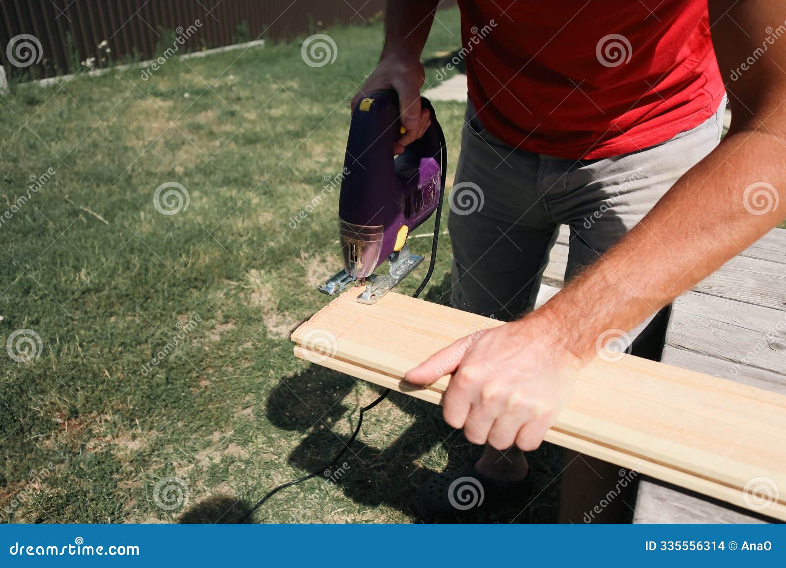 Carpenter Installing Decking Boards. Carpenter Building Wooden Deck ...