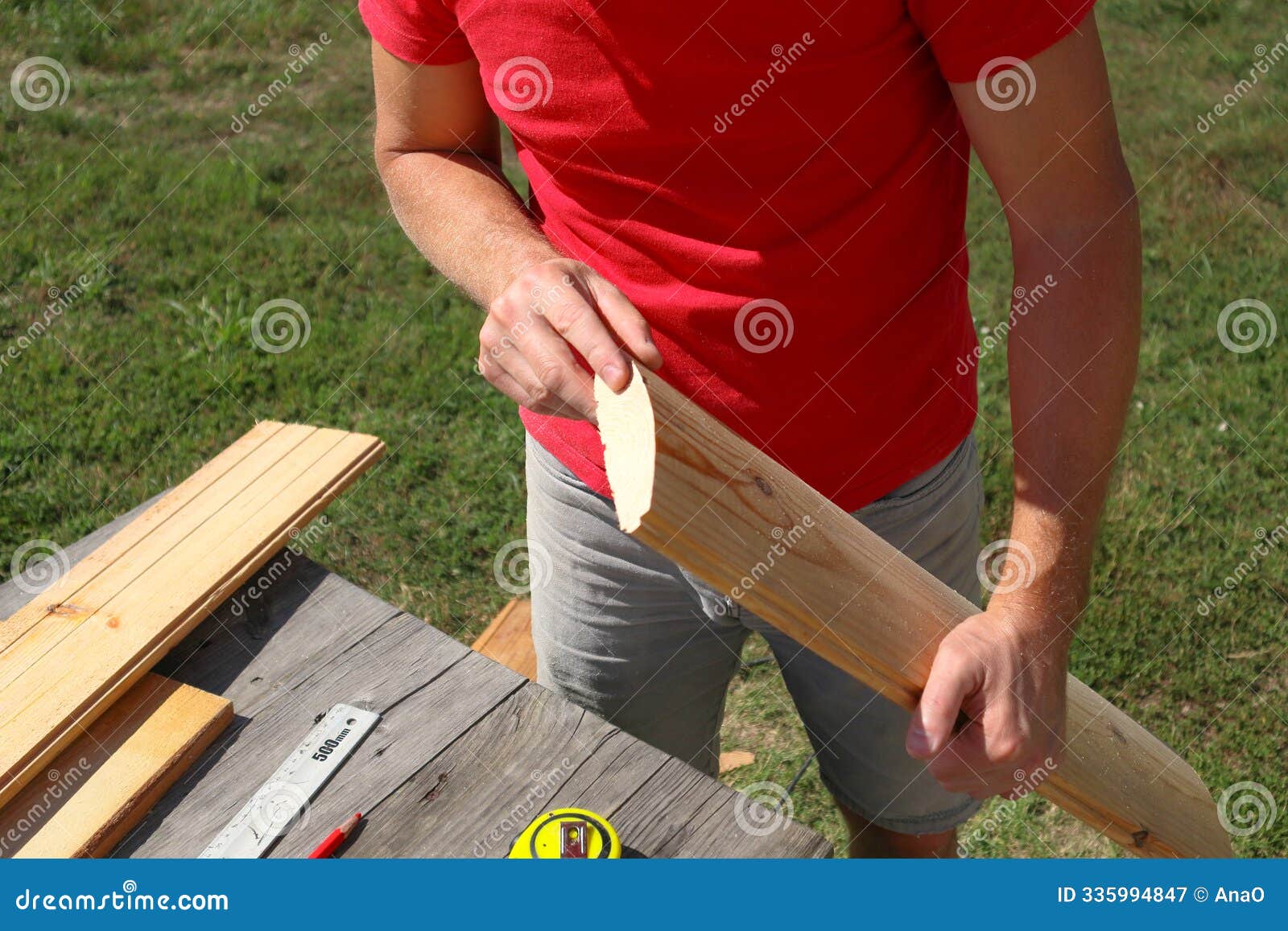 Carpenter Installing Decking Boards. Carpenter Building Wooden Deck ...