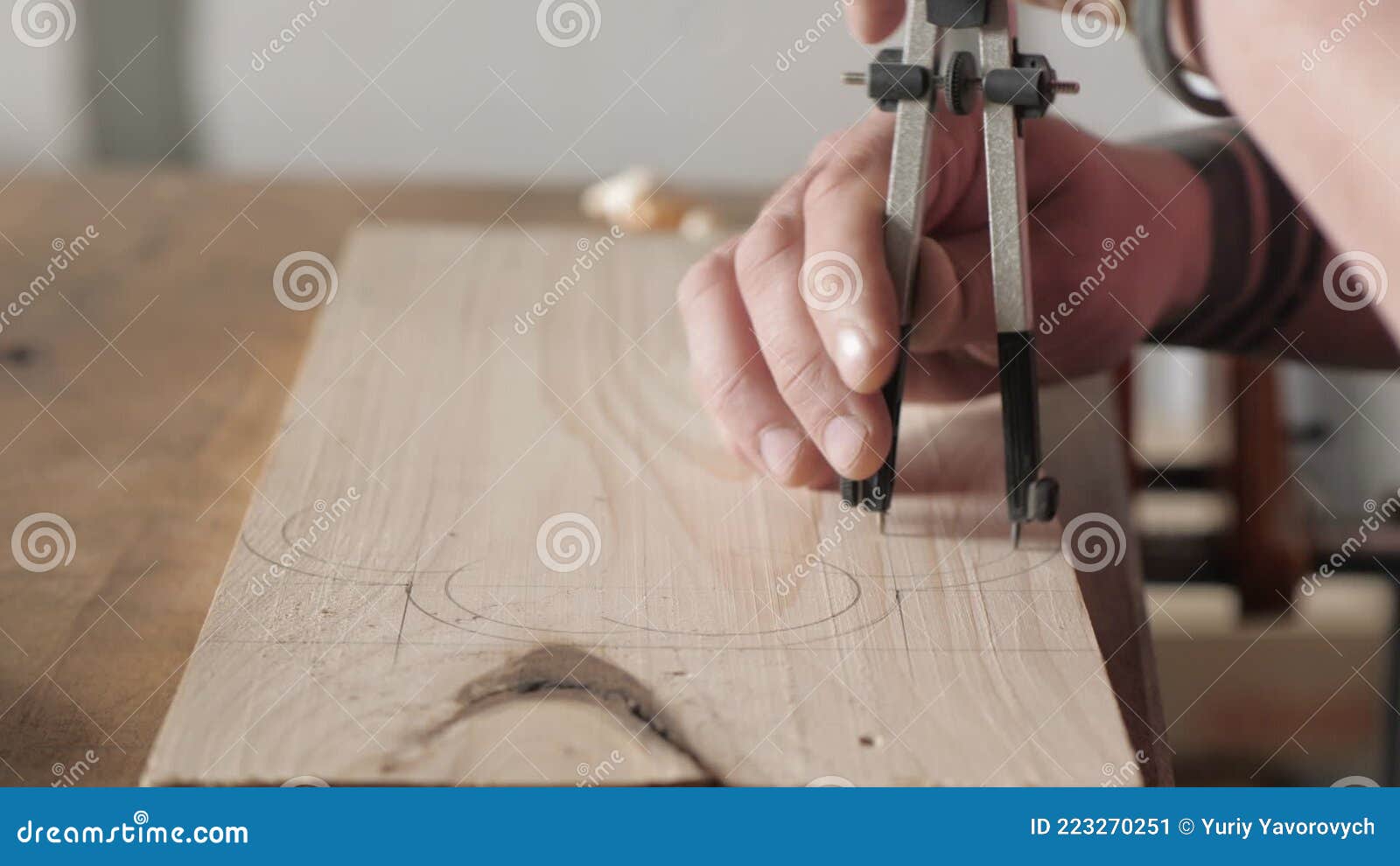 A Carpenter Marks a Pine Wooden Plank with a Compass. Woodworker Using ...