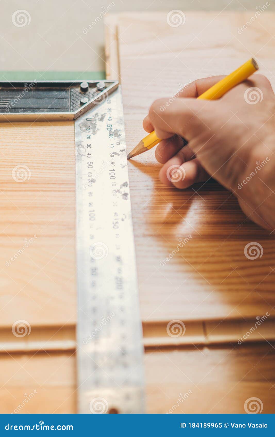 The Carpenter Marks The Distance To Measure With A Pencil On A Tape ...