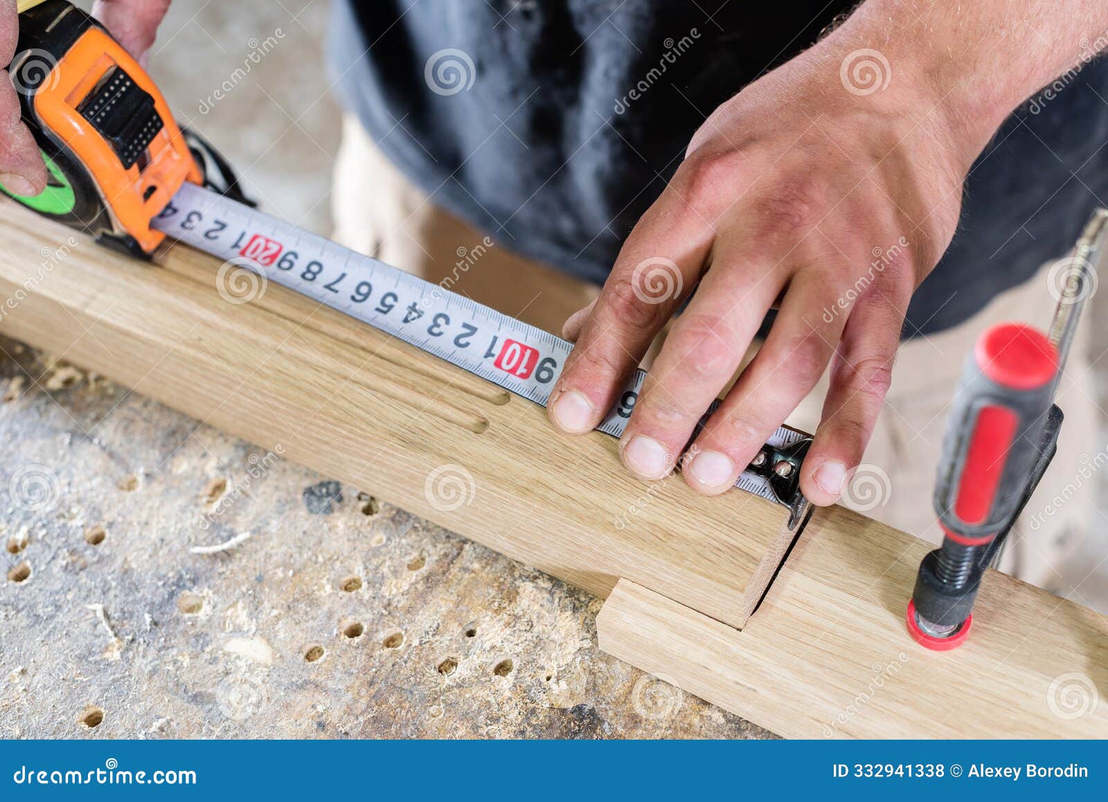 Carpenter Measures The Distance Using A Measure And Marks With A ...