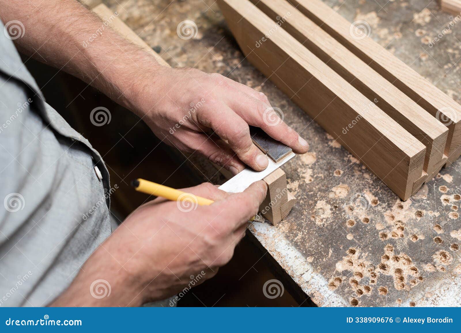 The Carpenter Measures The Distance Using A Measure And Marks With A ...