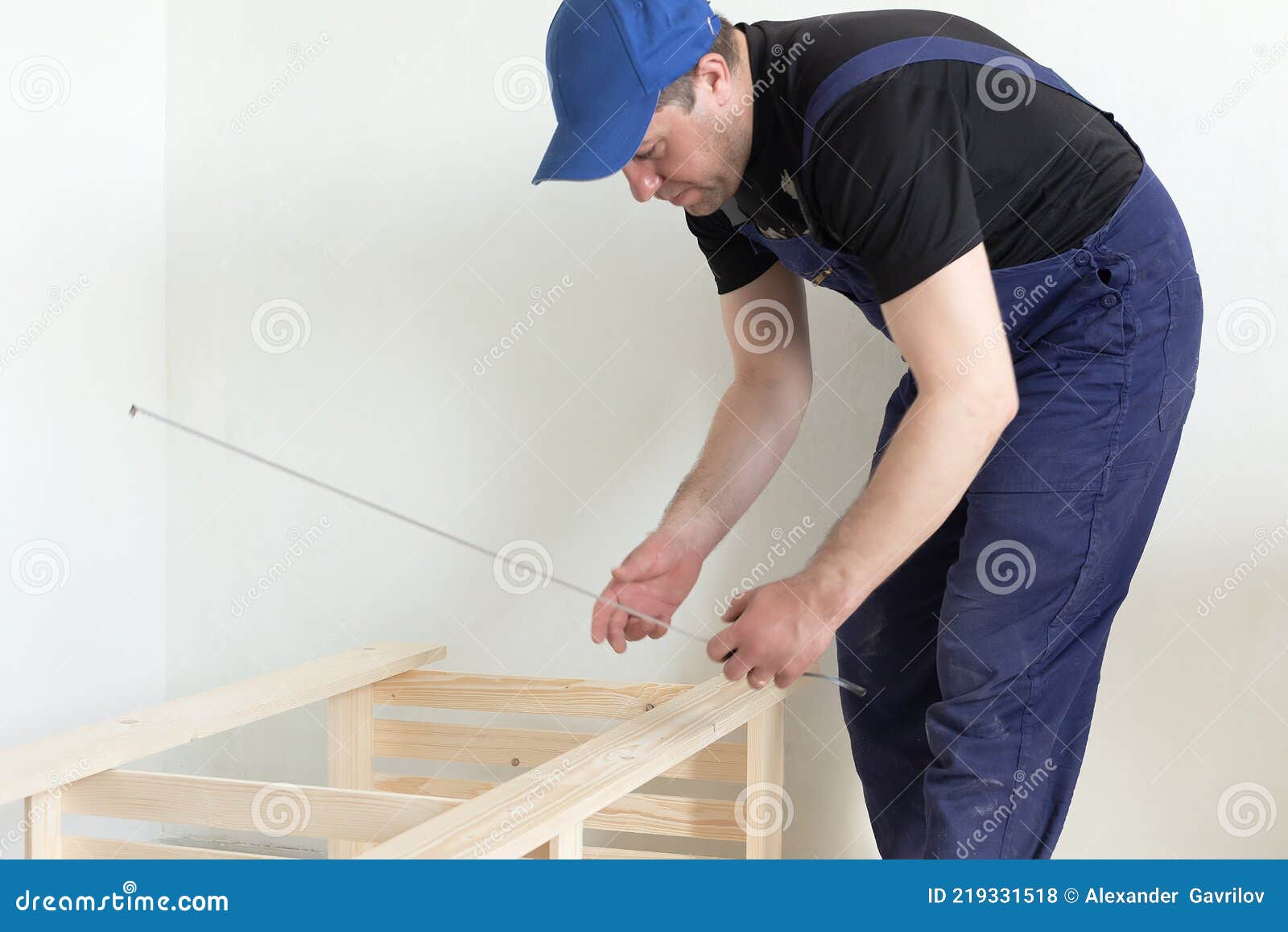 Carpenter Measures The Width Between The Legs Royalty-Free Stock Photo ...