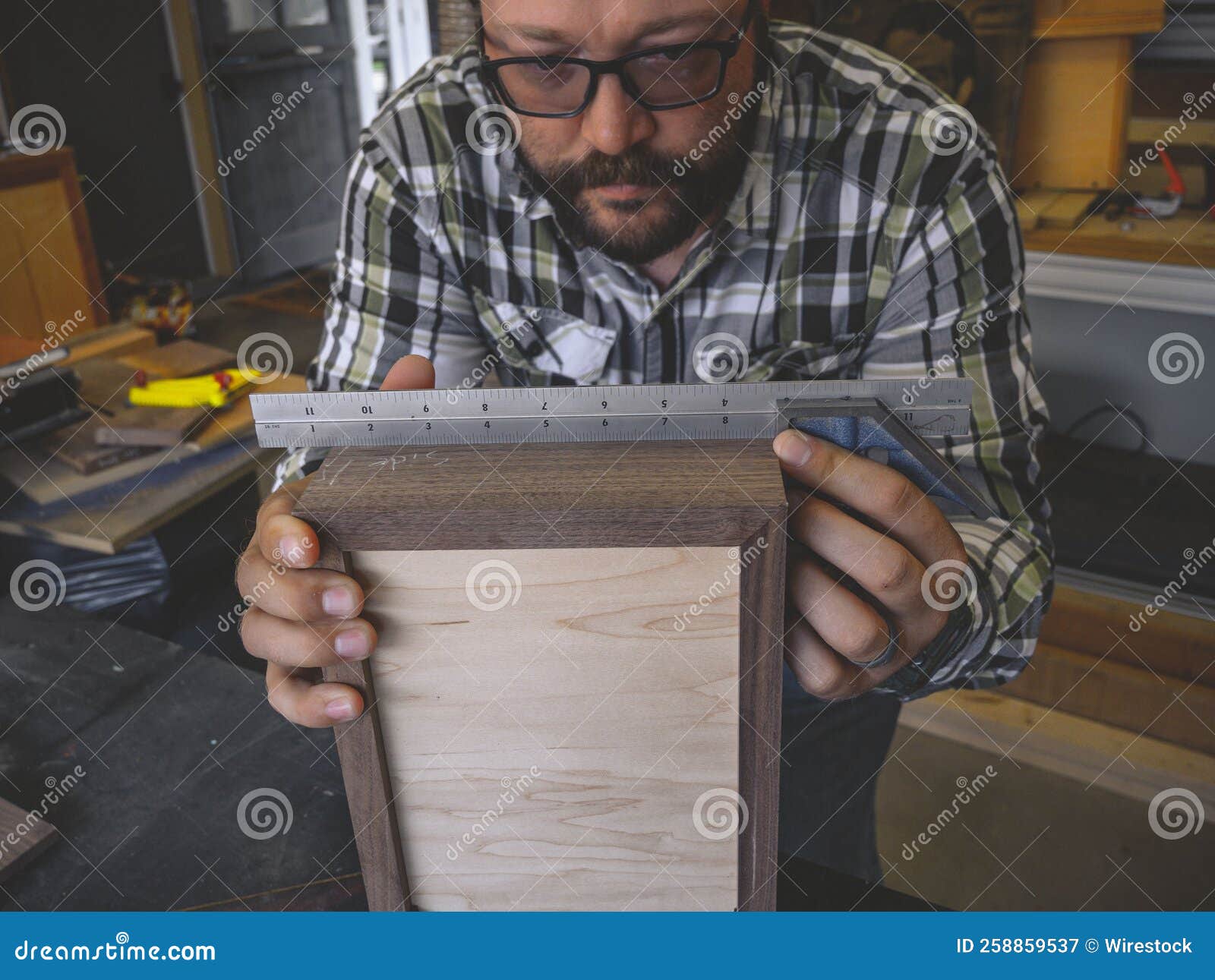 A Carpenter Measuring Out the Next Steps on the Box he is Building ...