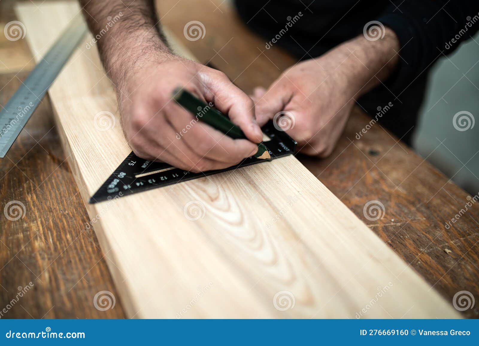 Carpenter Holding a Set Square on the Work Bench Stock Photo - Image of ...