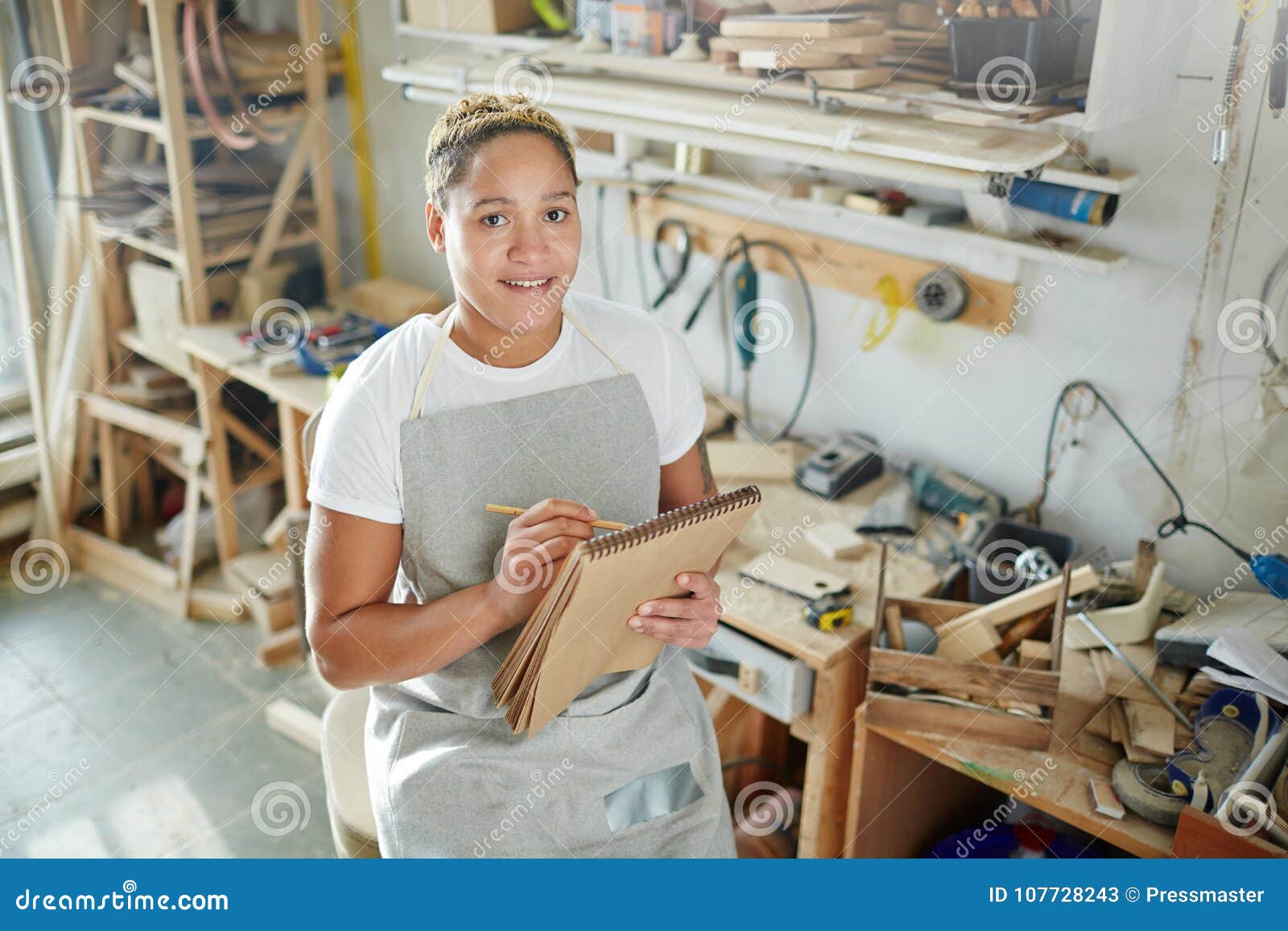 Carpenter with notepad stock image. Image of workshop - 107728243