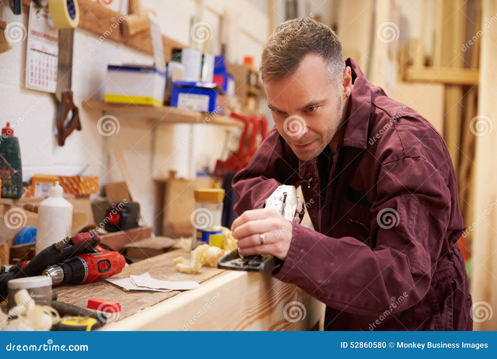Carpenter Planing Wood in Workshop Stock Photo - Image of working ...