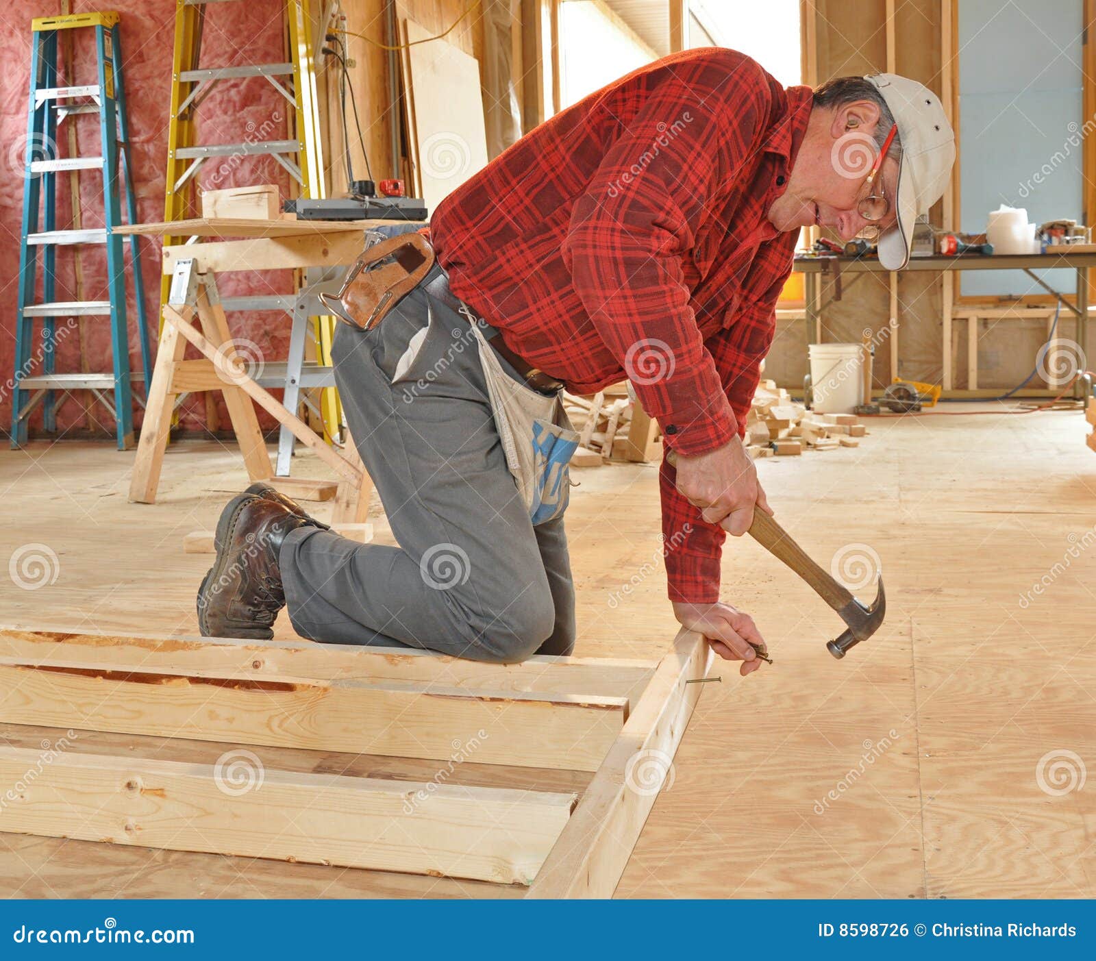 Carpenter Pounding Nail into Interior Wall Stock Photo - Image of house ...