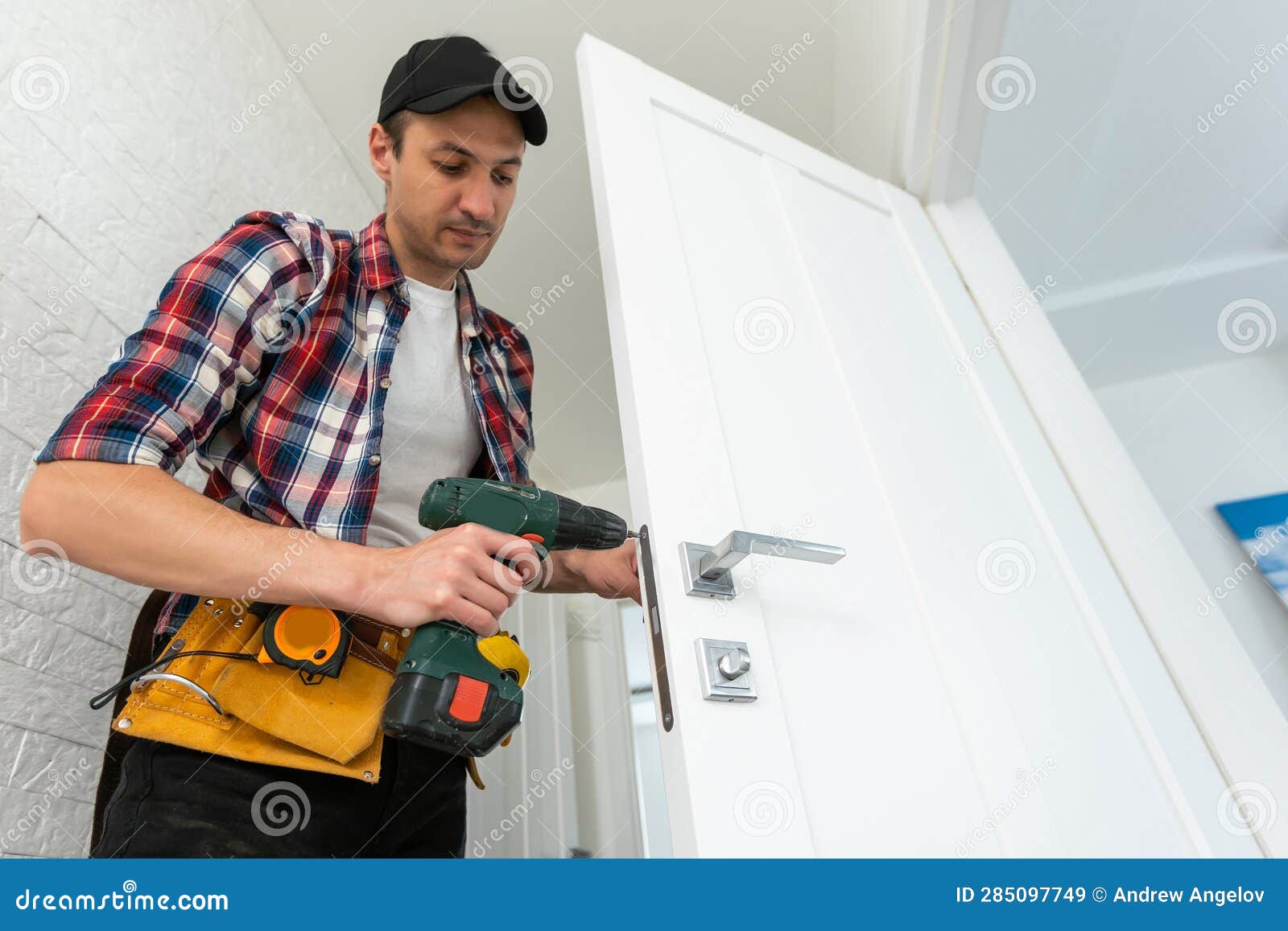 Carpenter Repairing Door Lock. Installing a Door Handle Stock Image ...