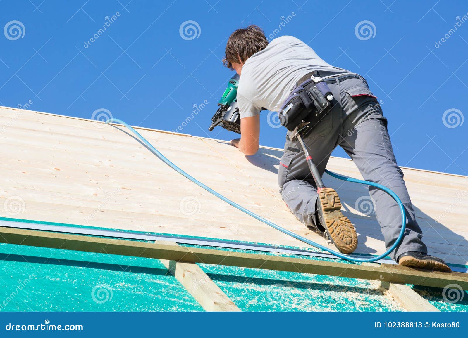 Builder at Work with Wooden Roof Construction. Stock Image - Image of ...