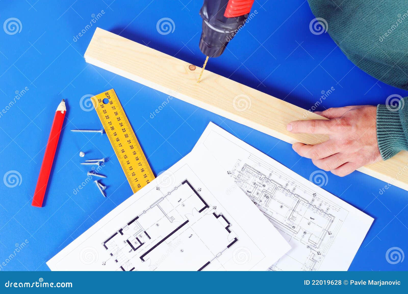 Carpenter`s Hand with Blueprints and Drill Machine Stock Photo - Image ...