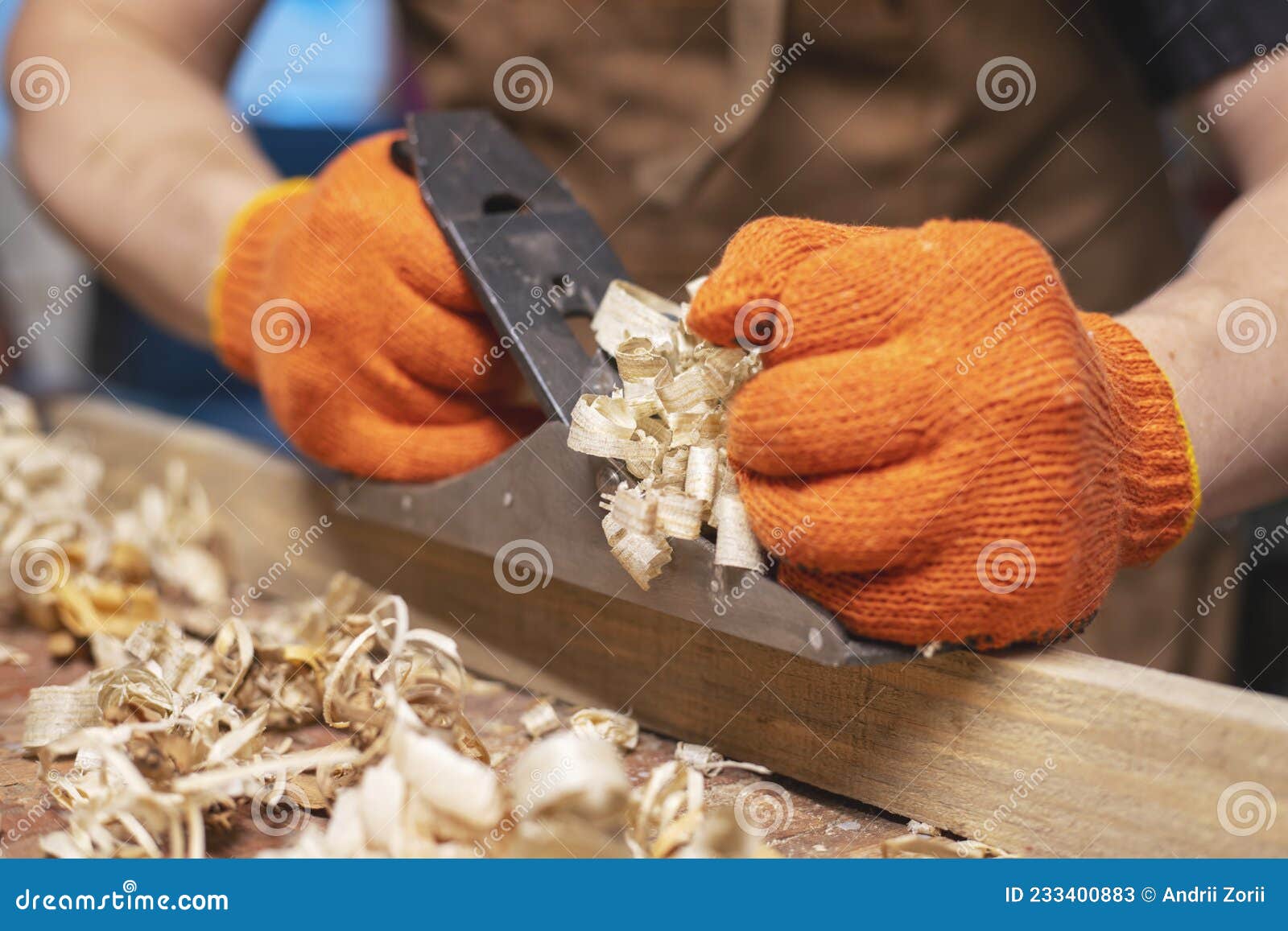Carpenter`s Hands Planing a Plank of Wood with a Hand Plane, Workplace ...