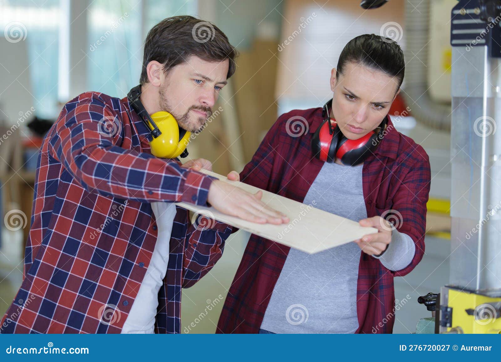 Carpenter Showing Apprentice How To Use Sawing Machine Stock Image ...