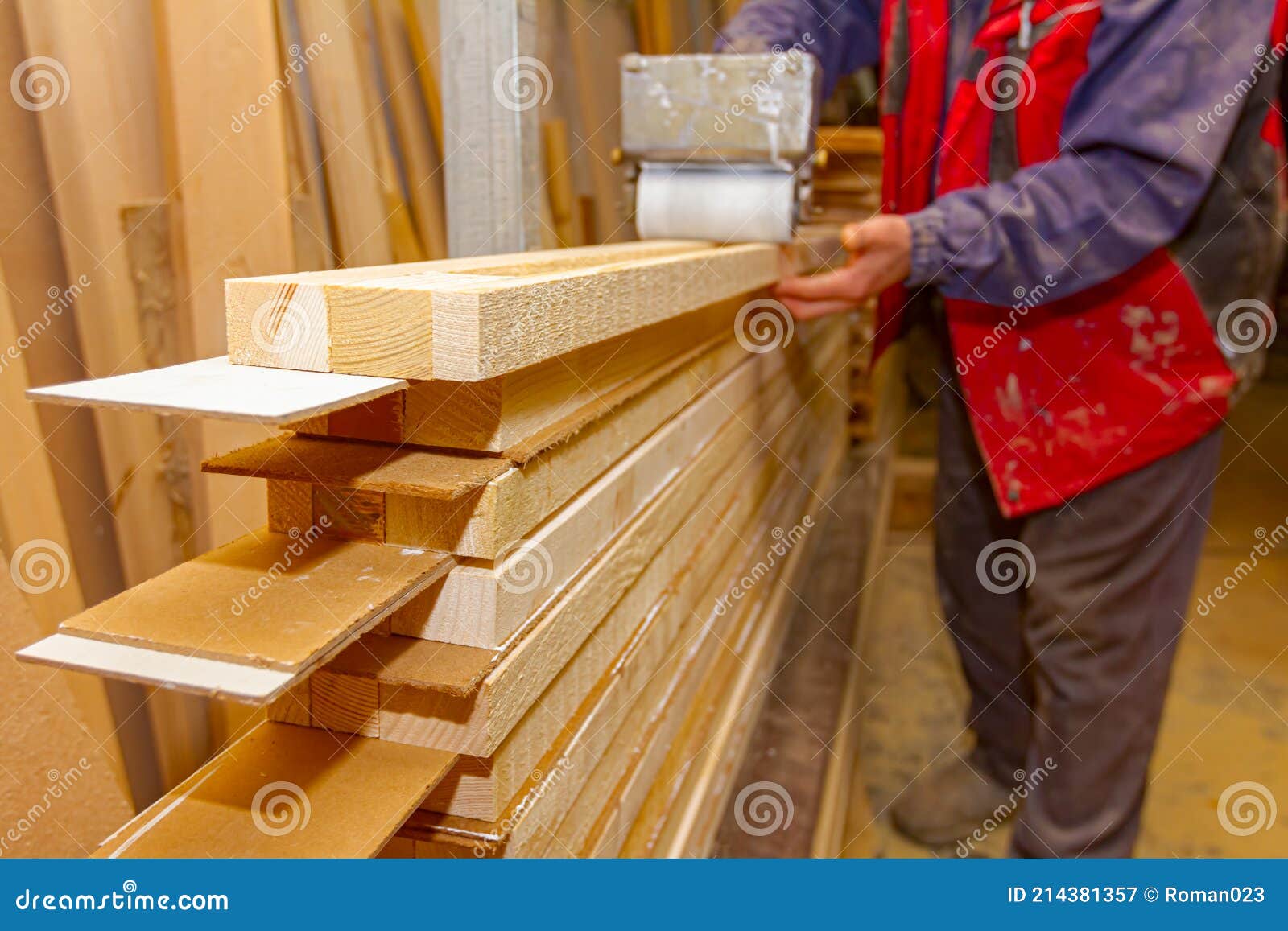Carpenter Smears The Boards With Hand Roller Tool, Spreader For Evenly ...