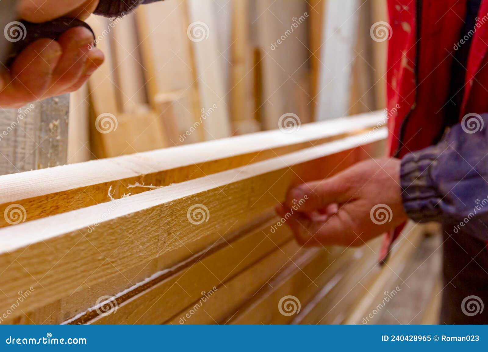 Carpenter Smears the Boards with Hand Roller Tool, Spreader for Evenly ...