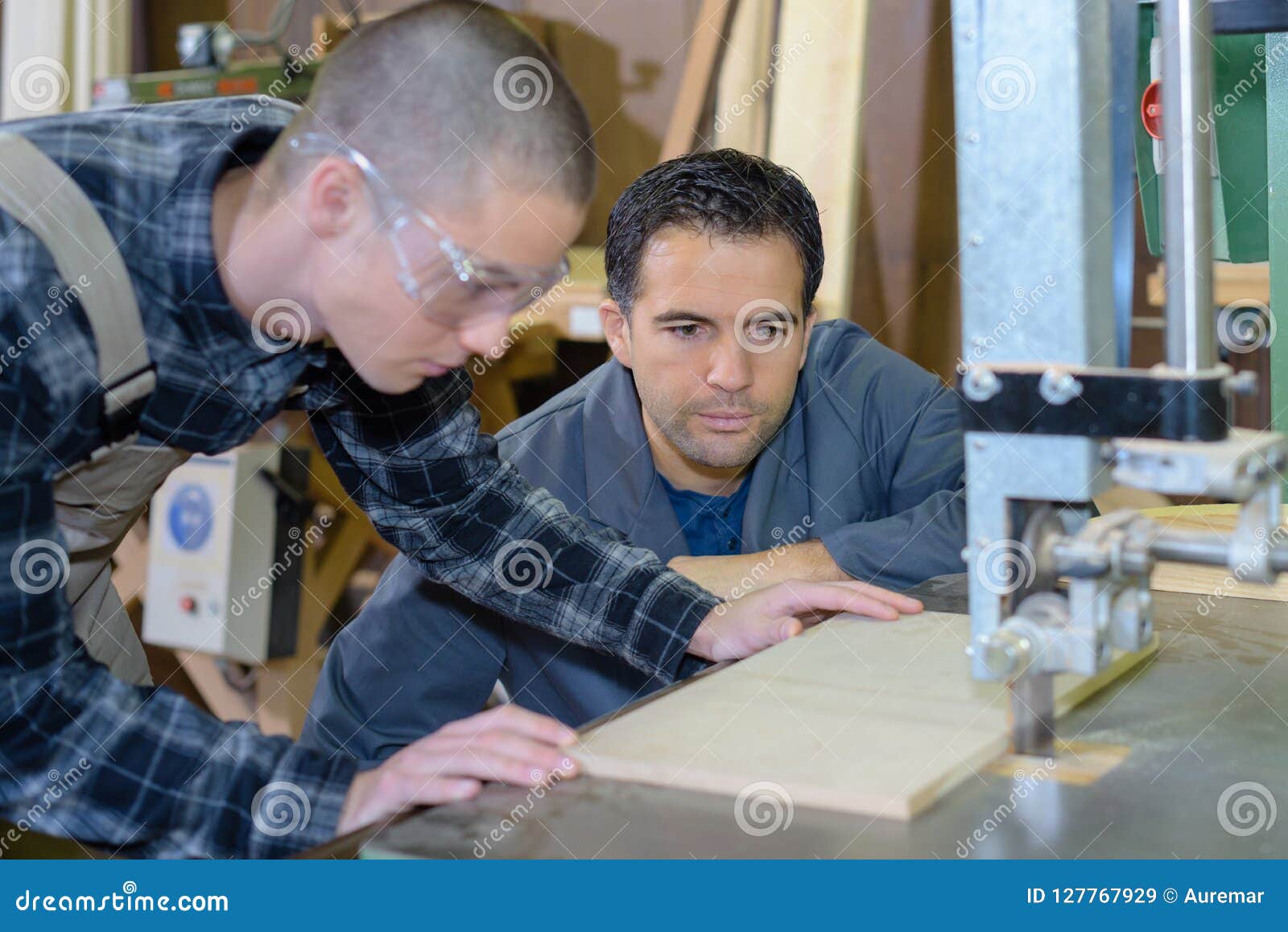 Carpenter Teaching Apprentice How To Measure Wood Stock Image - Image ...