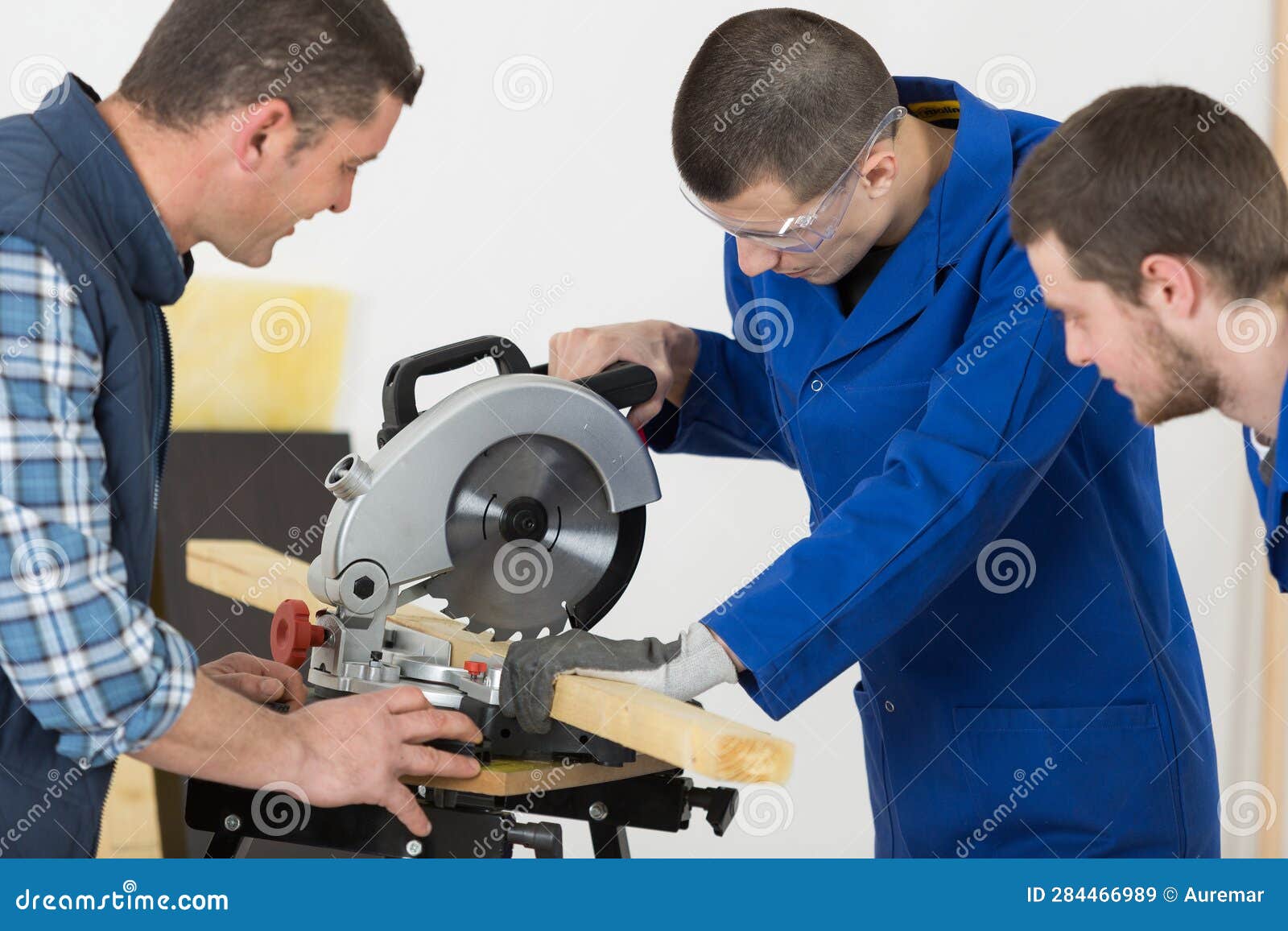 Carpenter Teaching Apprentices How To Use Circular Saw Stock Image ...
